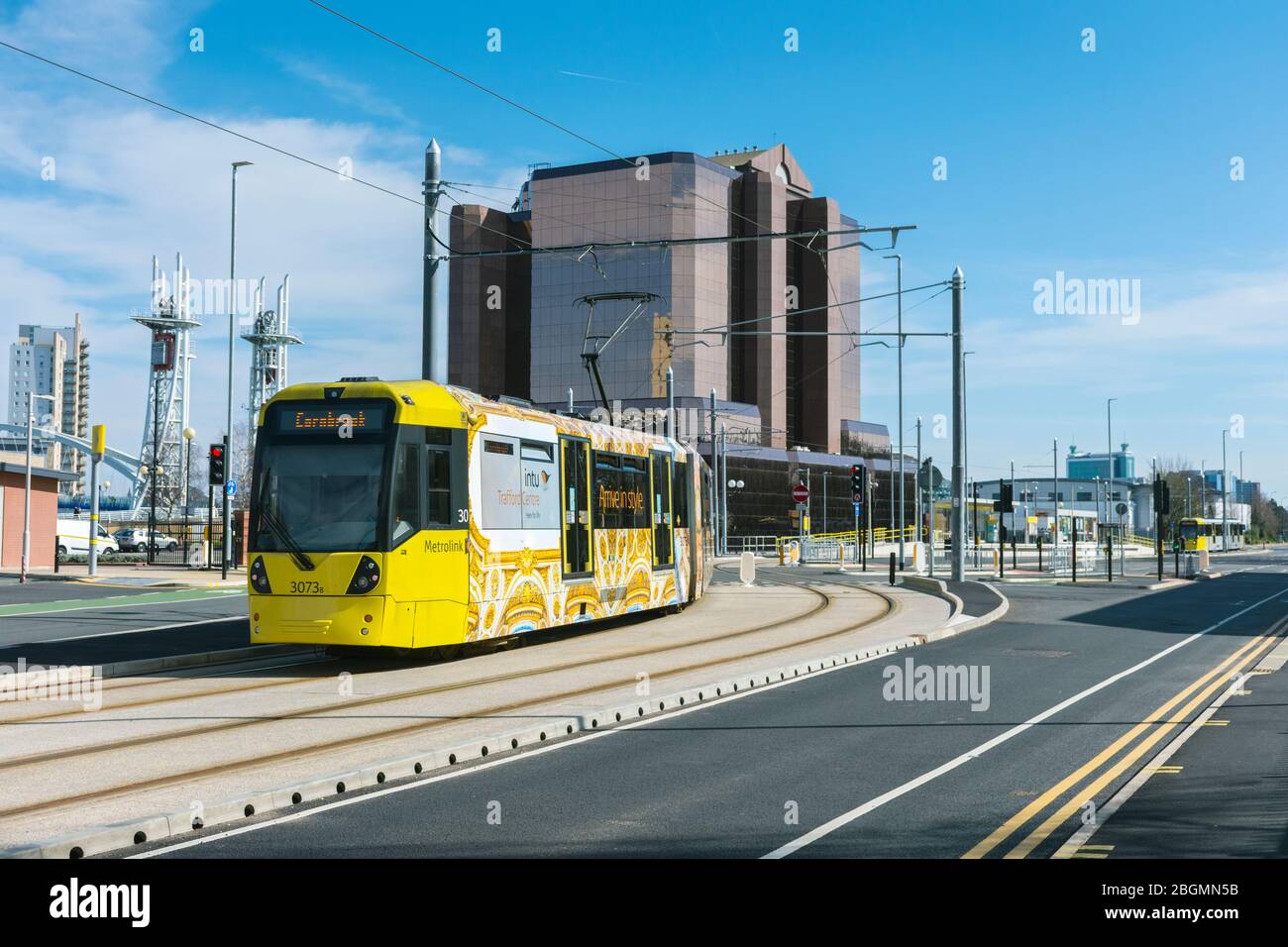 Metrolink tram approaching the Quay West building on the opening day of ...