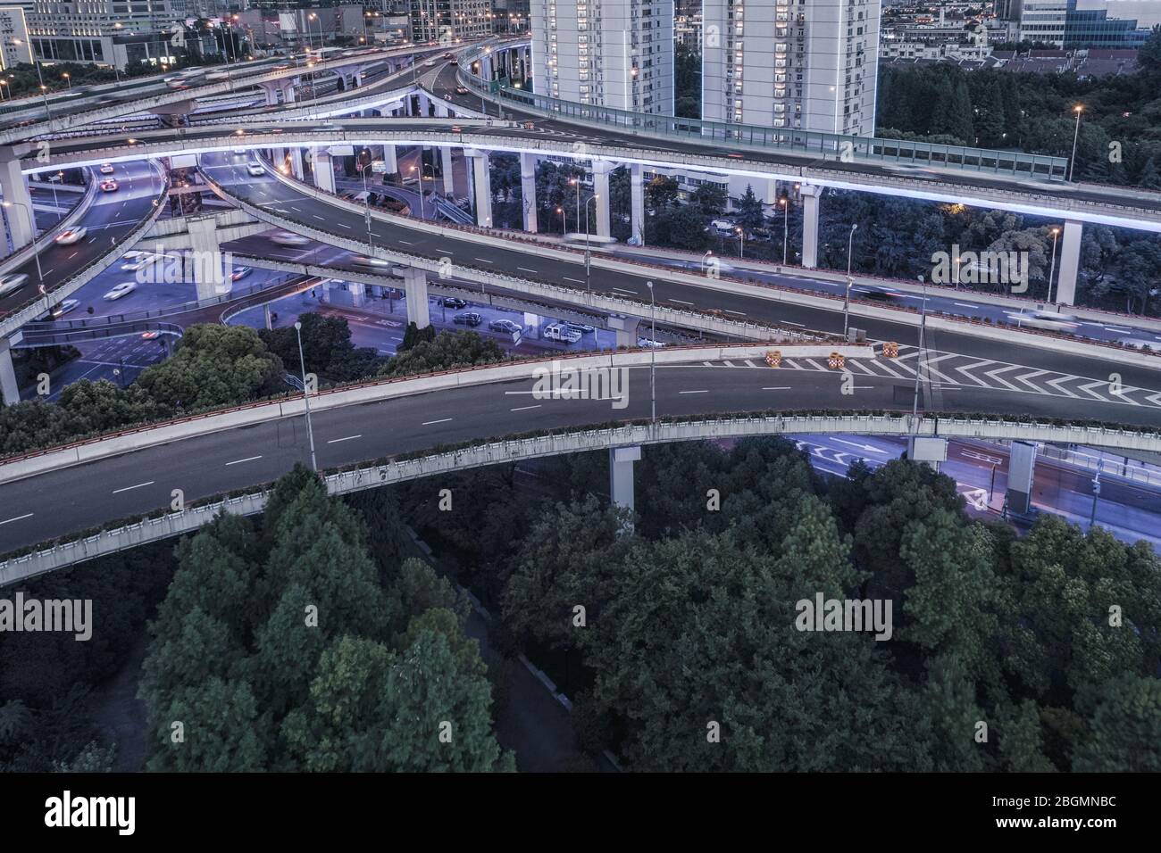 aerial view of highway interchange at dusk in shanghai city Stock Photo ...