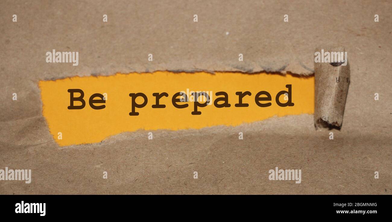 Be prepared words appearing behind torn brown paper. Risk crisis ...