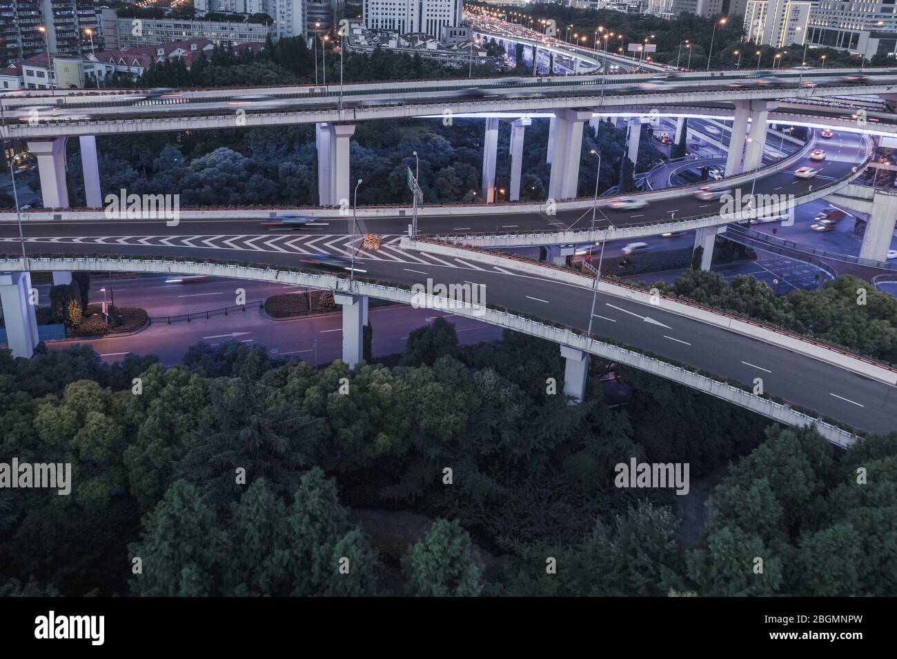 aerial view of highway interchange at dusk in shanghai city Stock Photo ...