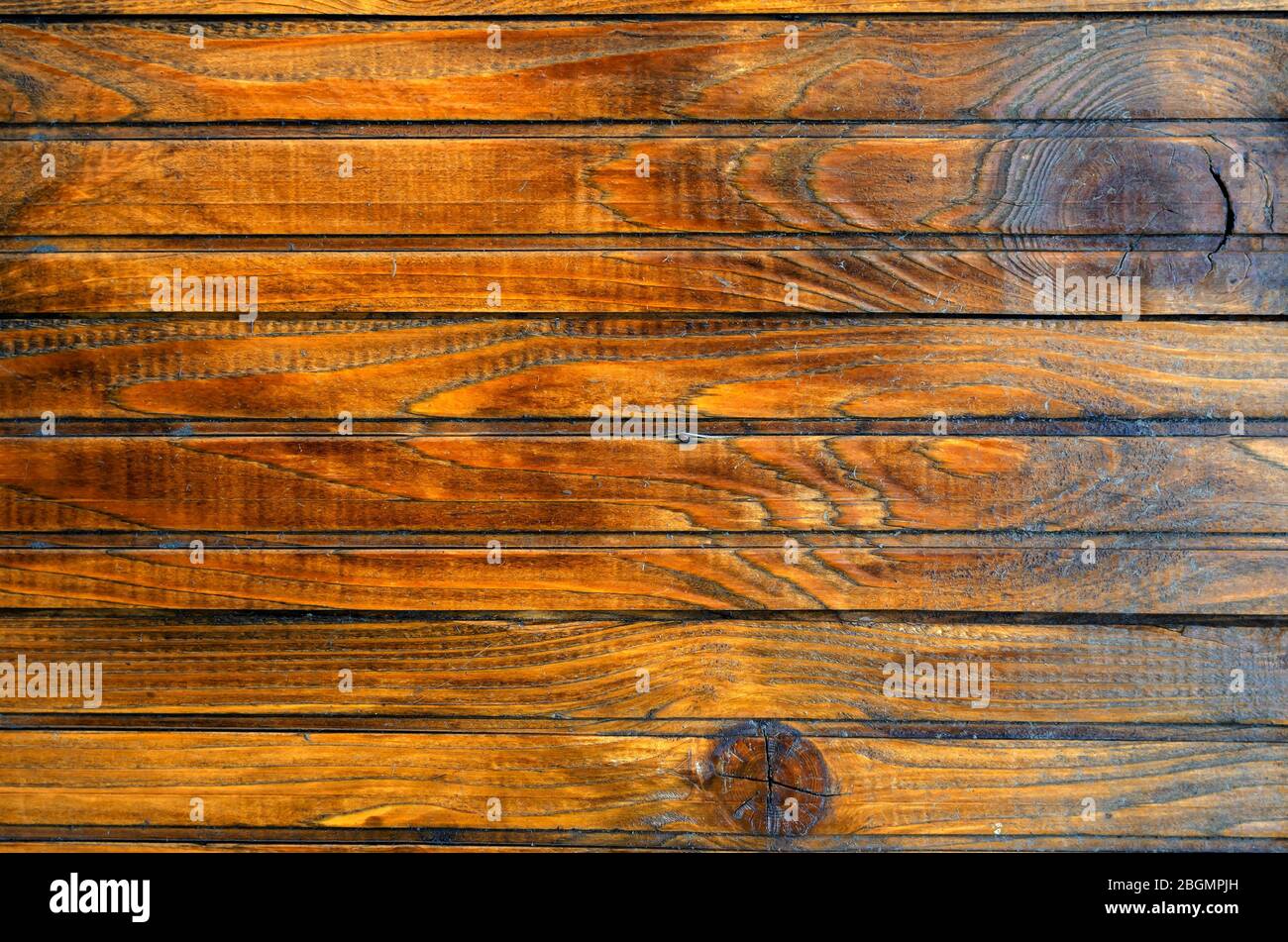 Varnished boards. Wooden shield made of yellow varnished boards. The ...