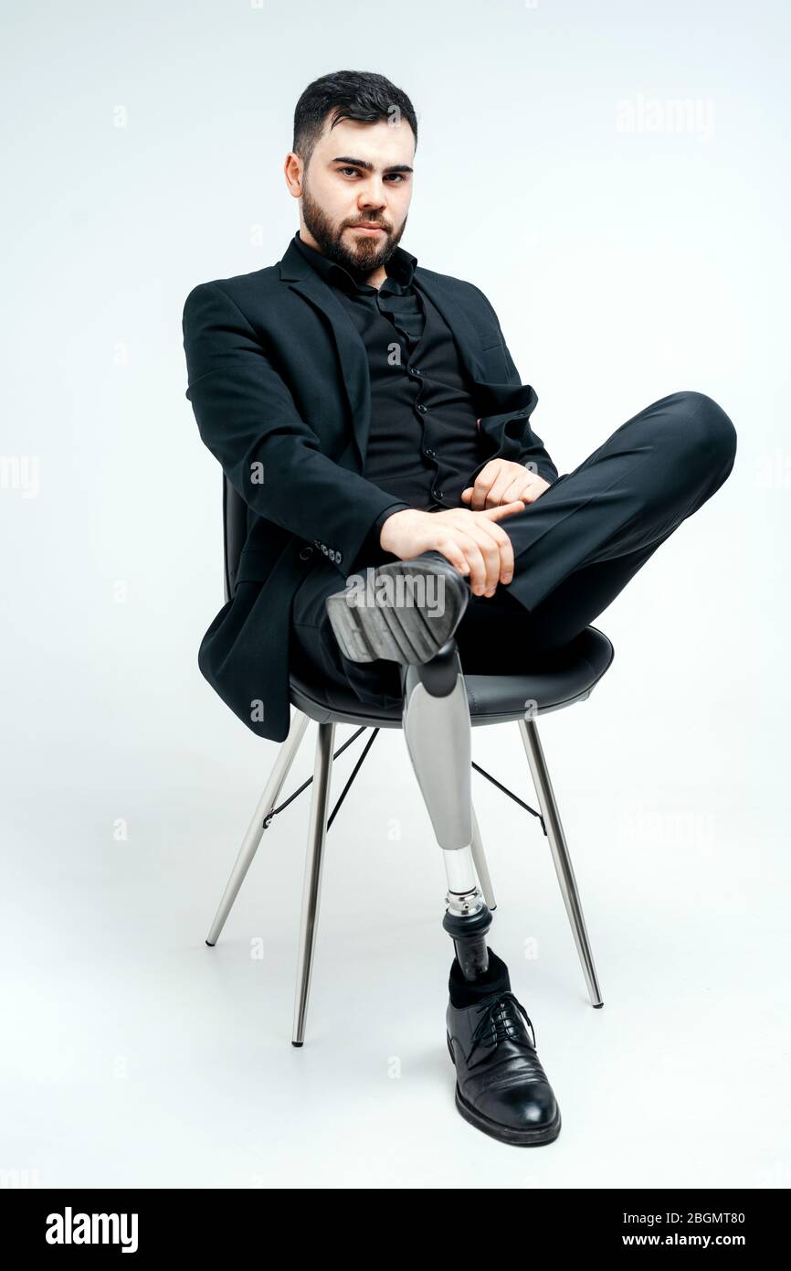 Disabled young man with prosthetic leg, artificial limb concept on ...
