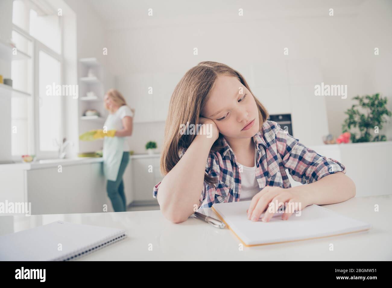 Portrait of frustrated kid feel bored sit table do homework blonde hair ...