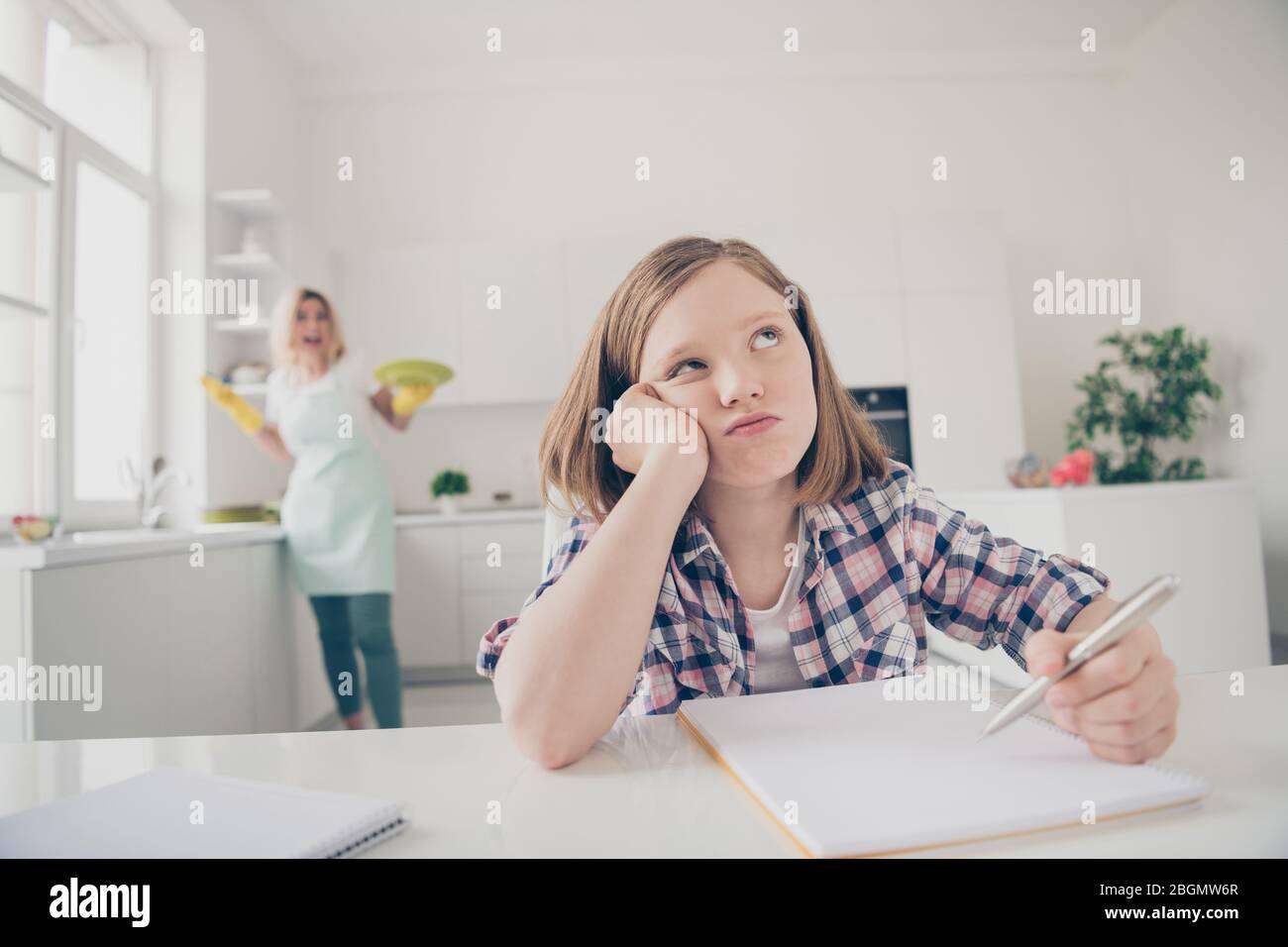 Photo of little blonde hair girl frustrated sit table cant do homework ...