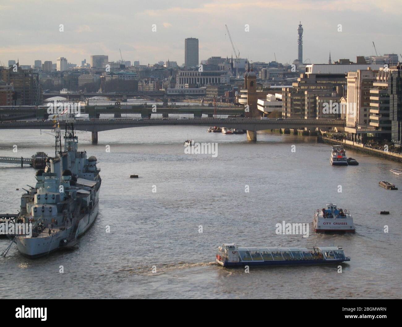View downstream of the River Thames from Tower Bridge walkway with the ...