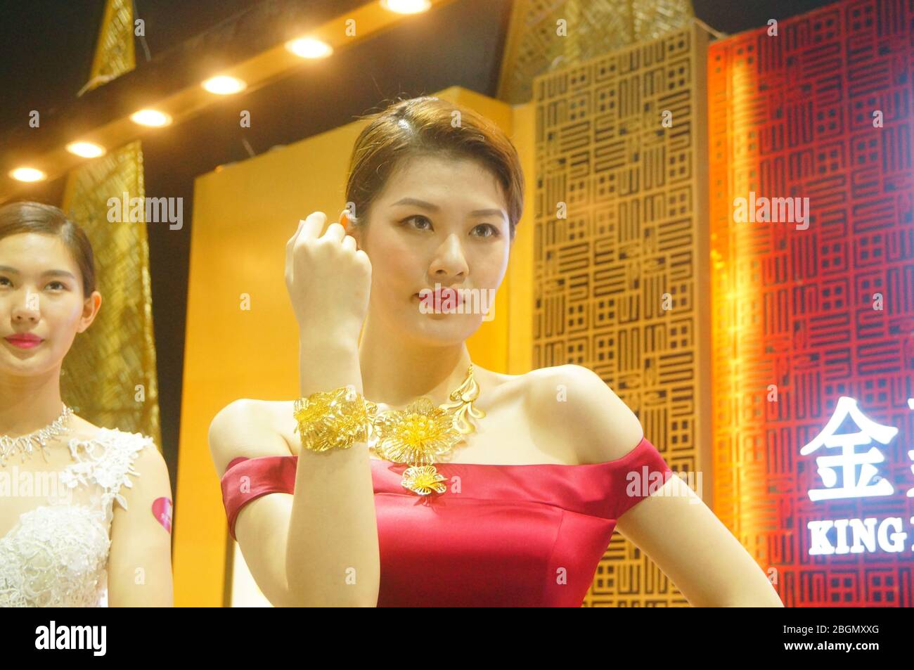 Female models show new gold jewelry Stock Photo - Alamy