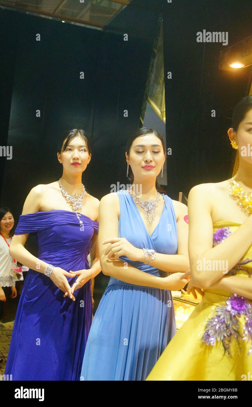 Female models show new gold jewelry Stock Photo - Alamy