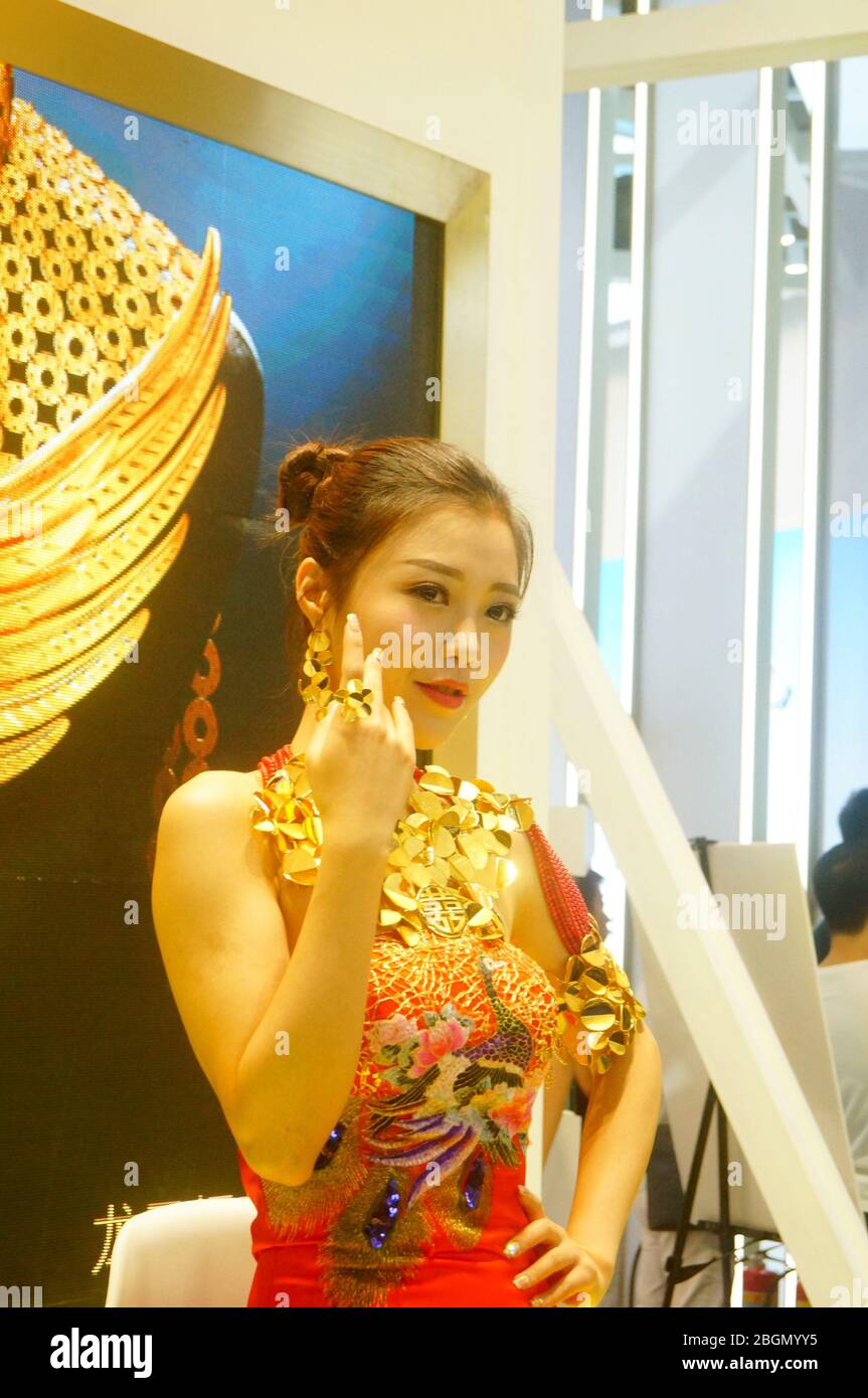 Female models show new gold jewelry Stock Photo - Alamy