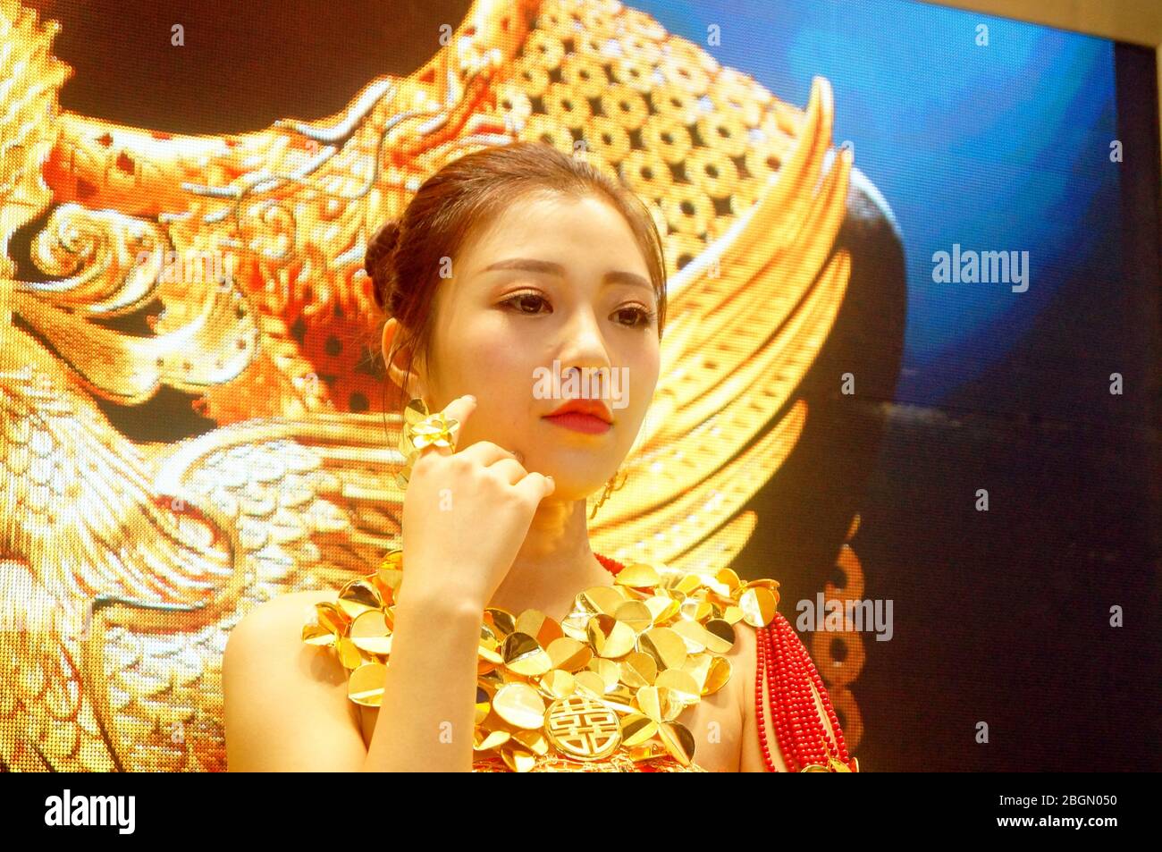 Female models show new gold jewelry Stock Photo - Alamy