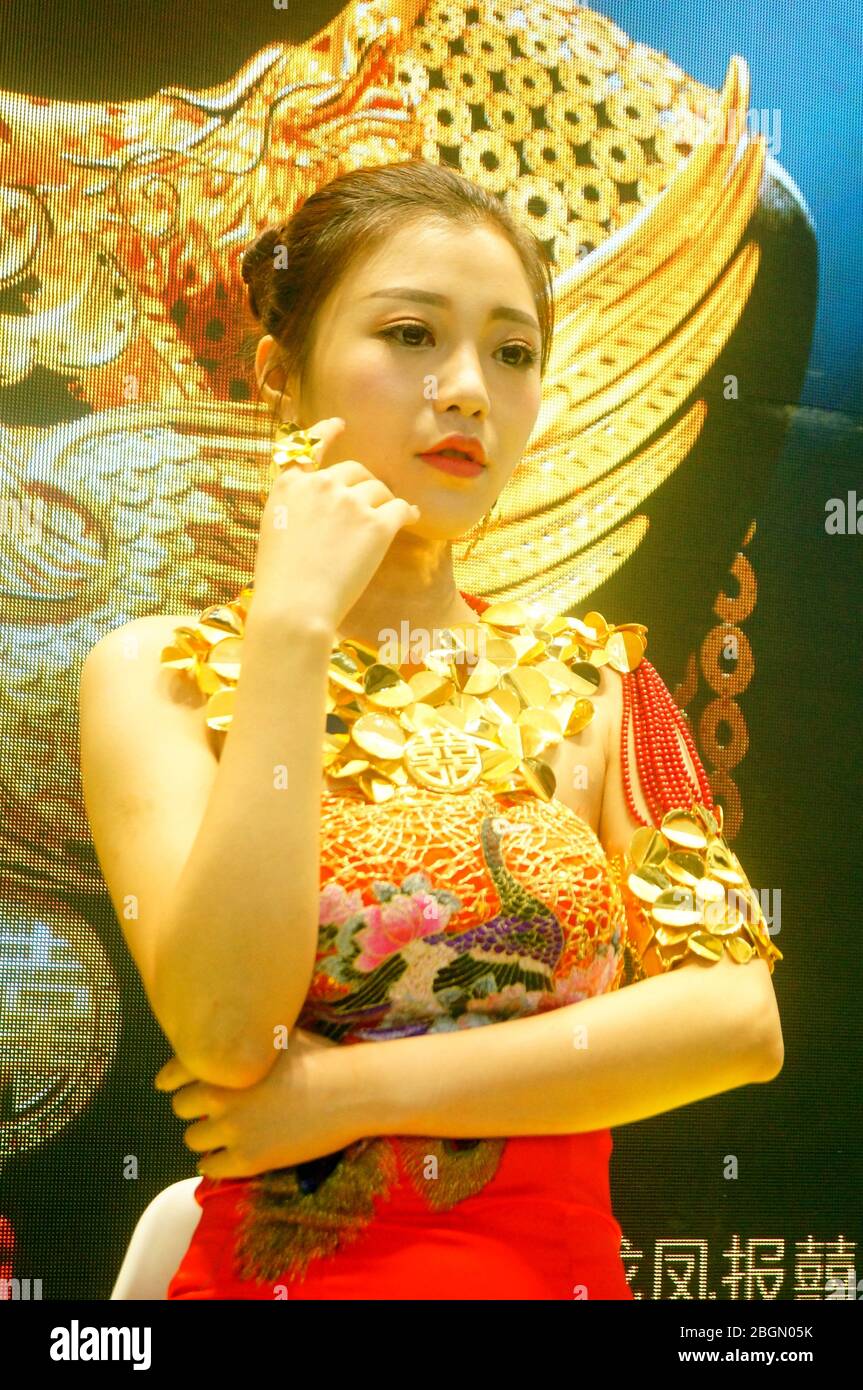 Female models show new gold jewelry Stock Photo - Alamy