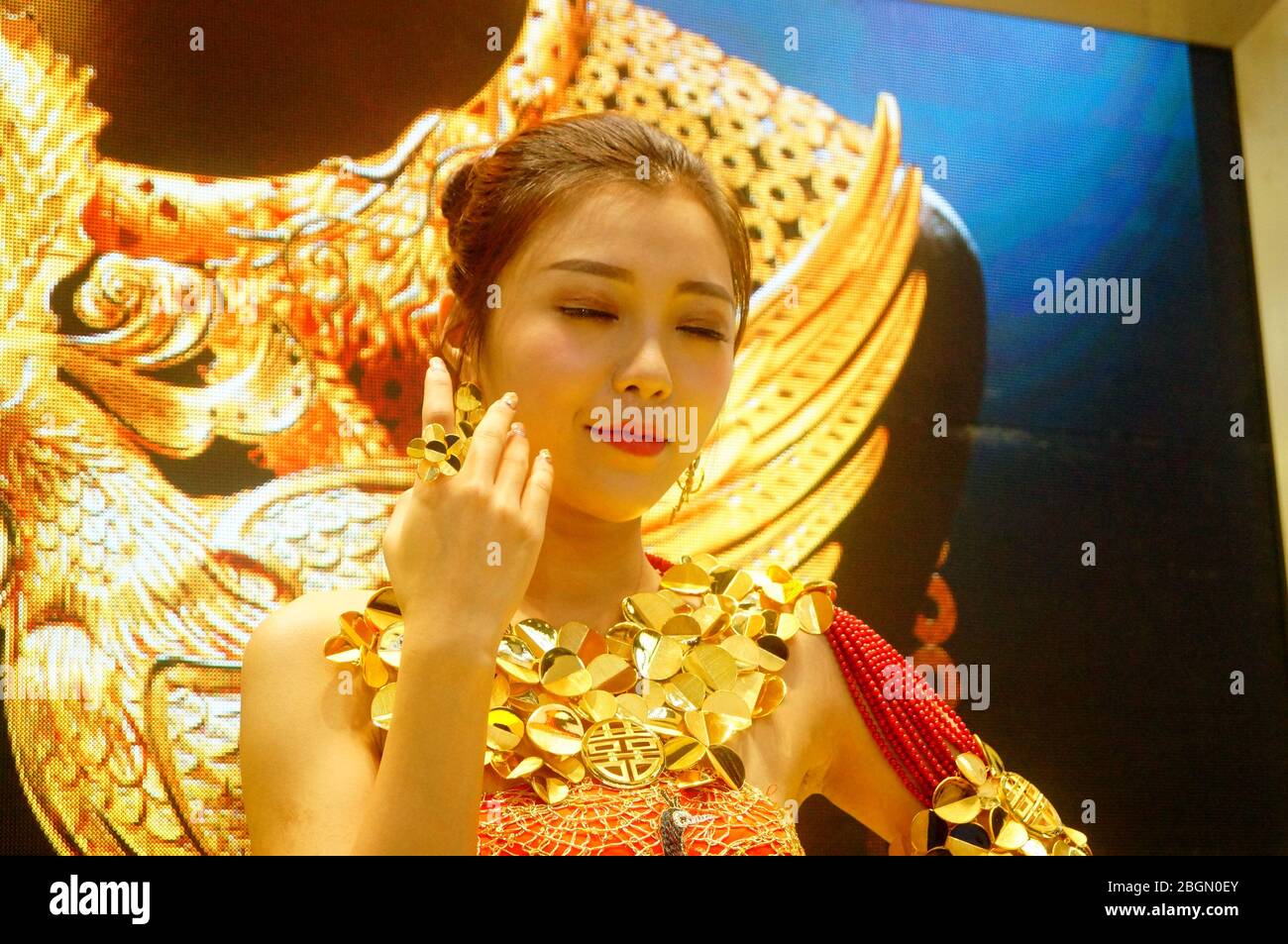 Female models show new gold jewelry Stock Photo - Alamy