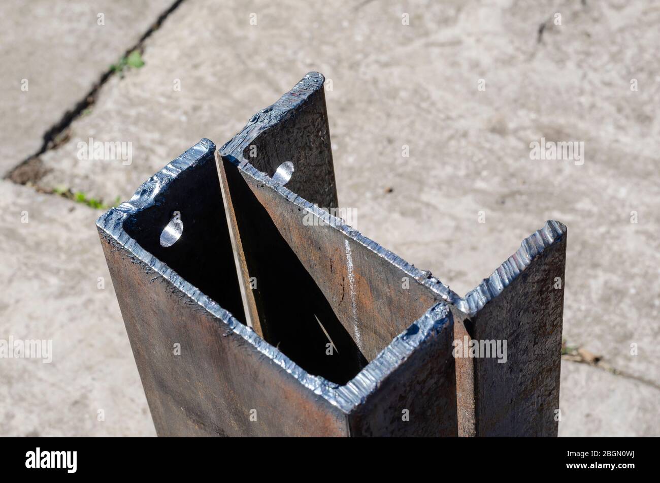 Metal construction details. Two metal channels with holes in the upper ...