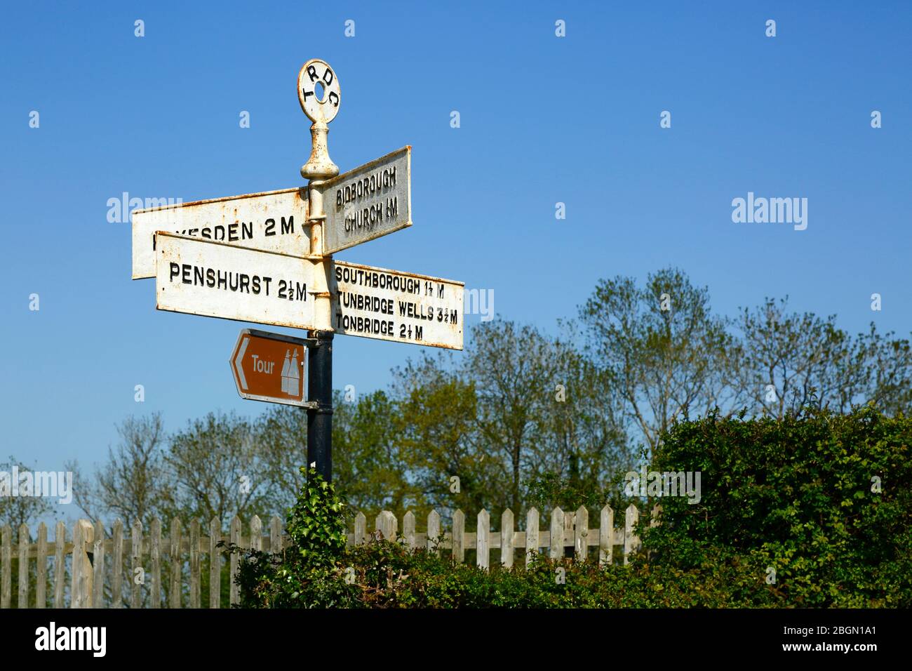 Old fashioned metal road sign with distances to Bidborough Church ...