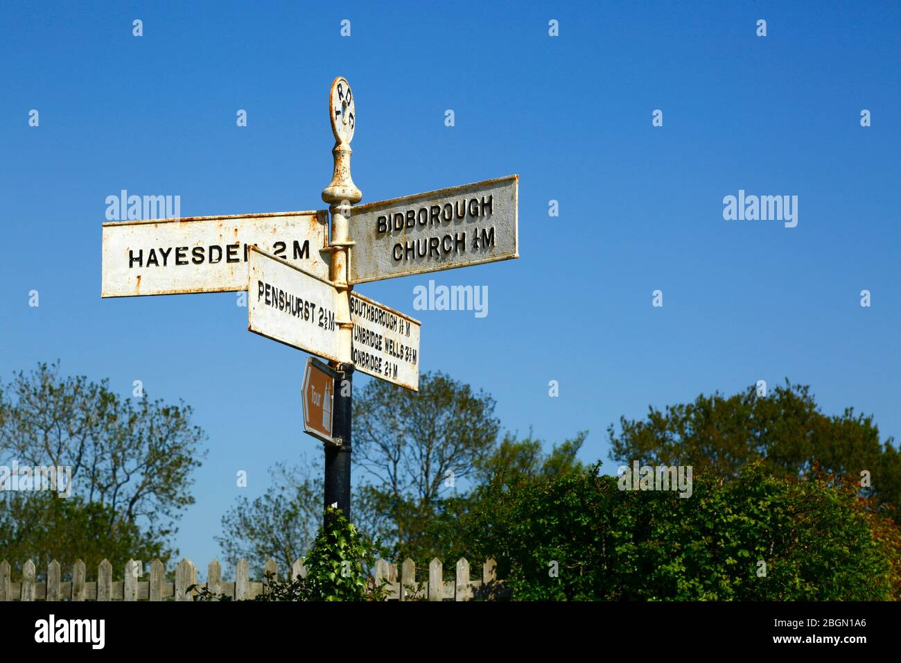 Old fashioned metal road sign with distances to Bidborough Church ...