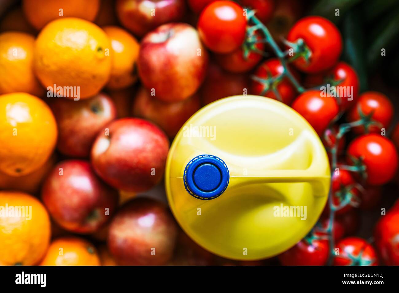 Fruit and vegetable box with a bottle of lye. Disinfecting fruits and ...