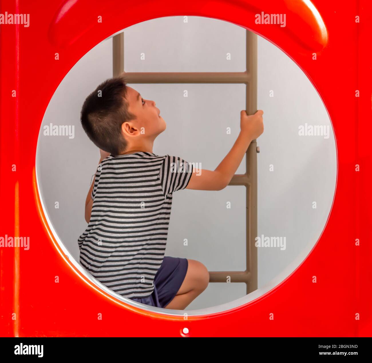 Portrait of Asian boys are climbing the ladder in the playground Stock ...