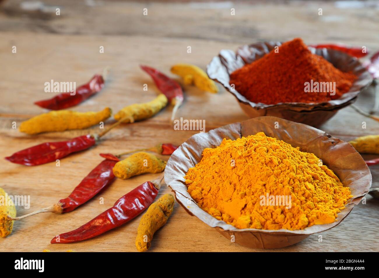 Indian style spices and herbs. Yellow turmeric powder and red chili ...