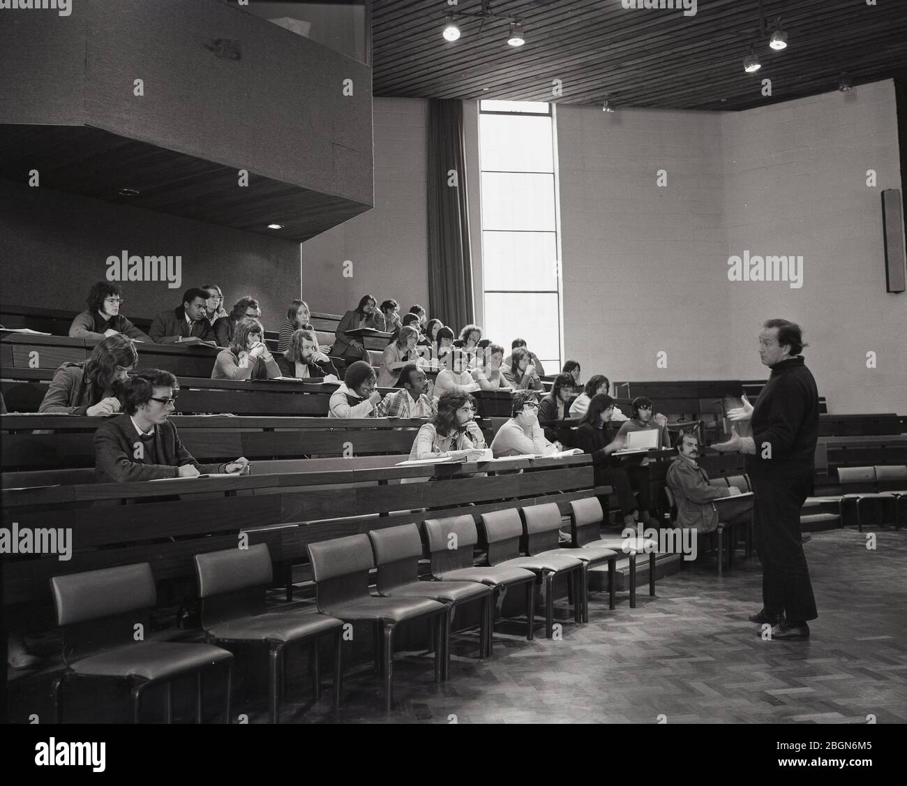1960s, historical, professior teaching mature students in a audiotorium ...