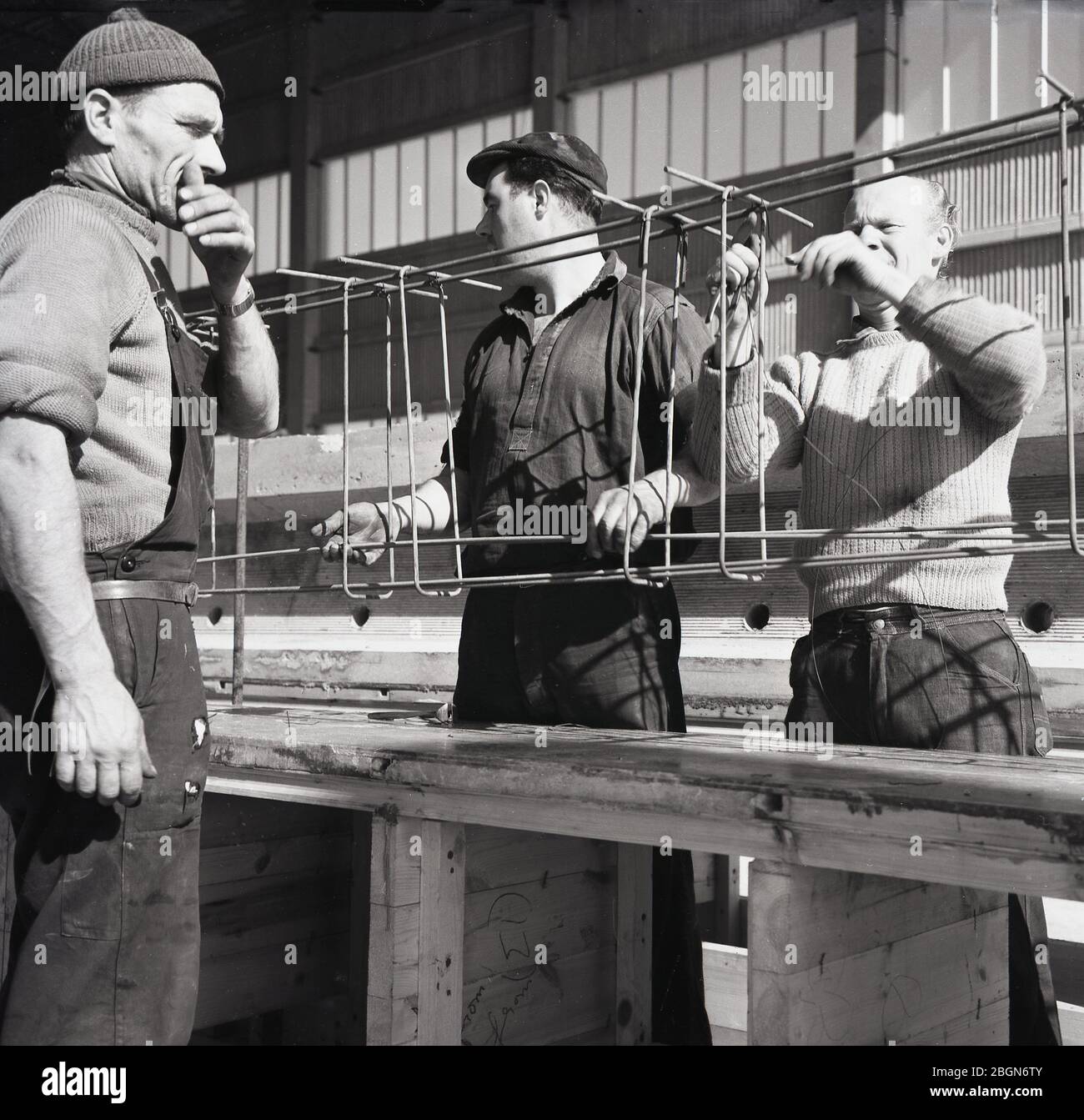 1960s, historical, male workers with steel frame inserts that go into ...
