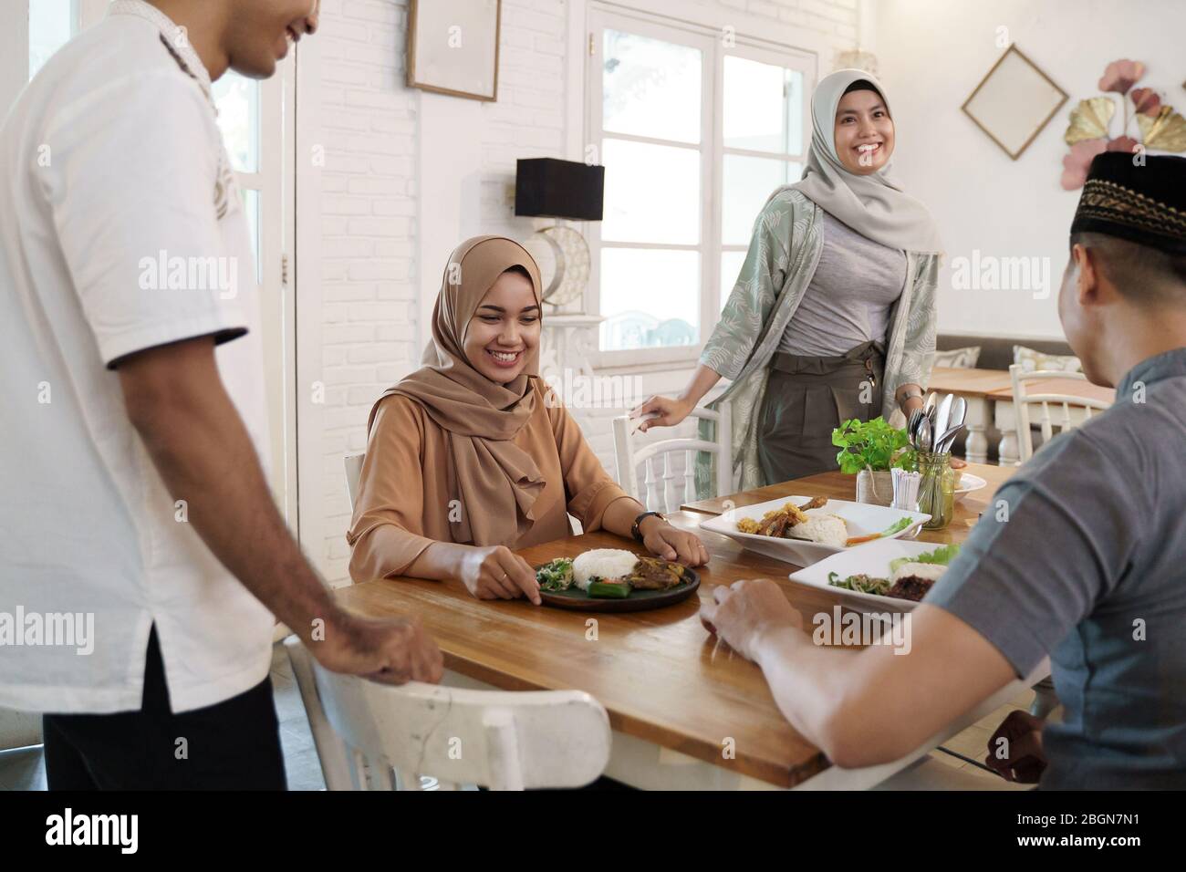 iftar on ramadan. friend muslim breaking the fast. eid mubarak Stock ...