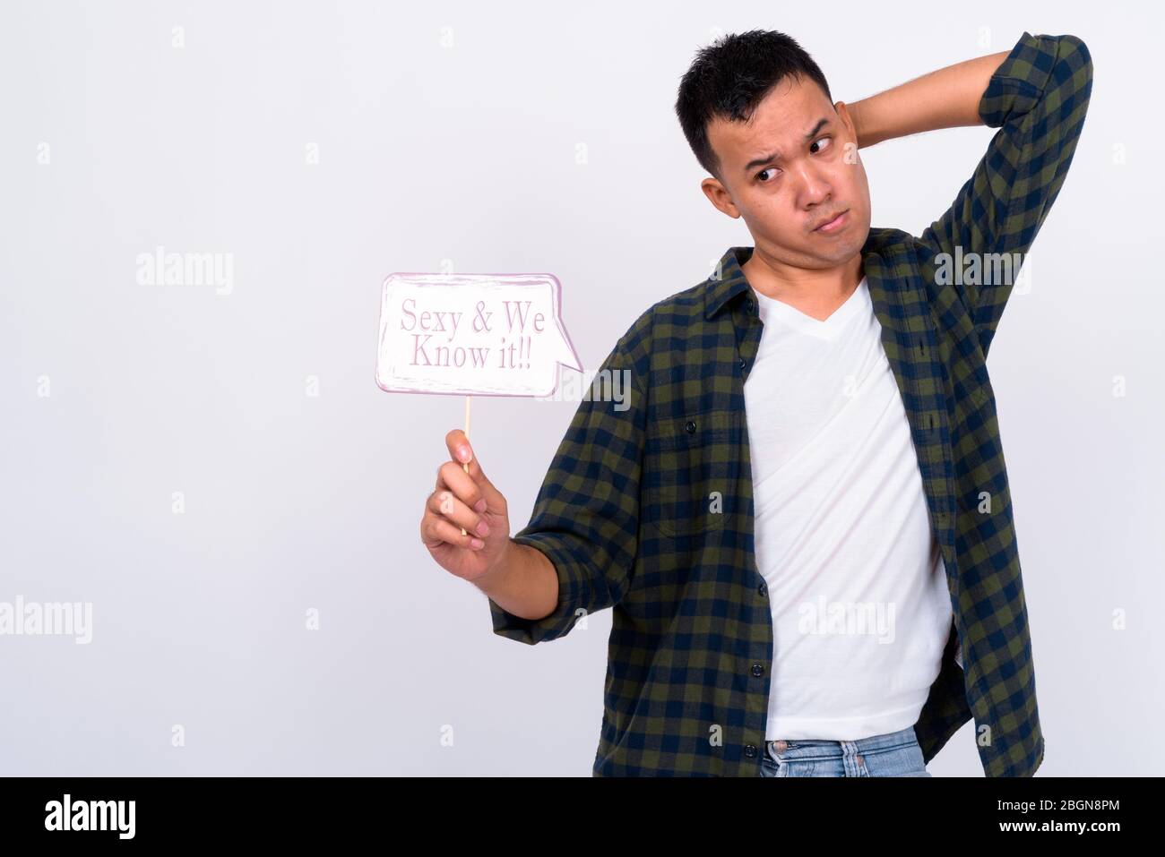 Portrait of young Asian man holding paper sign Stock Photo - Alamy