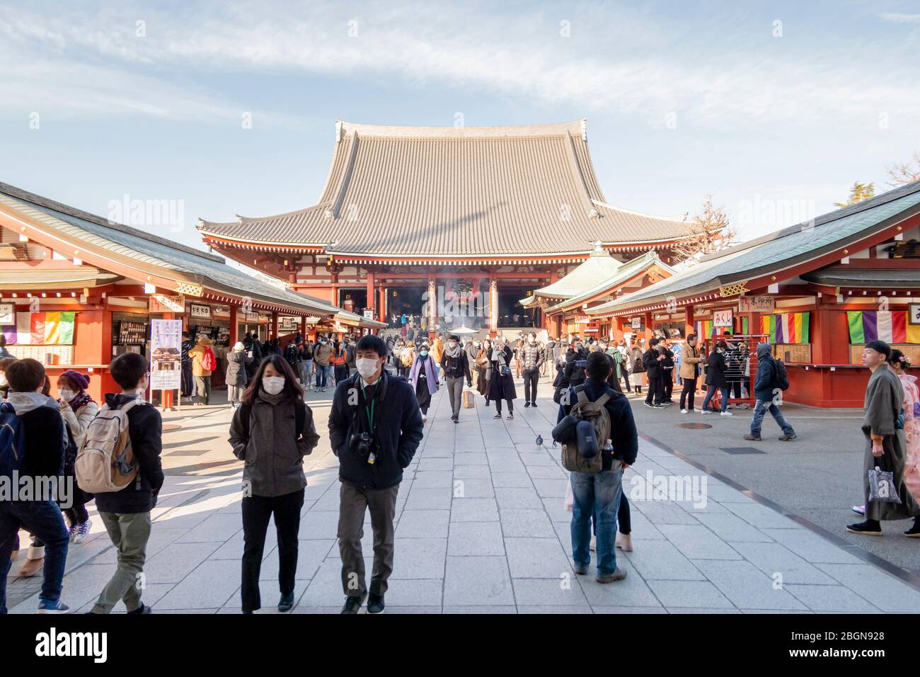 Many Japanese people walking at Asakusa temple while wearing masks to ...