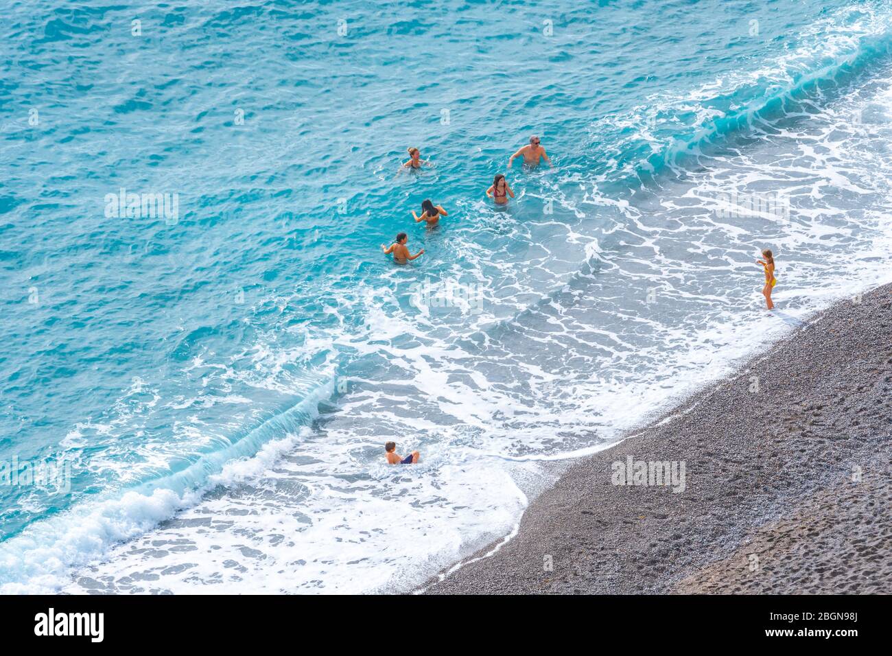 Positano, Italy - 2 November, 2019: People, sunbathing and swimming in ...