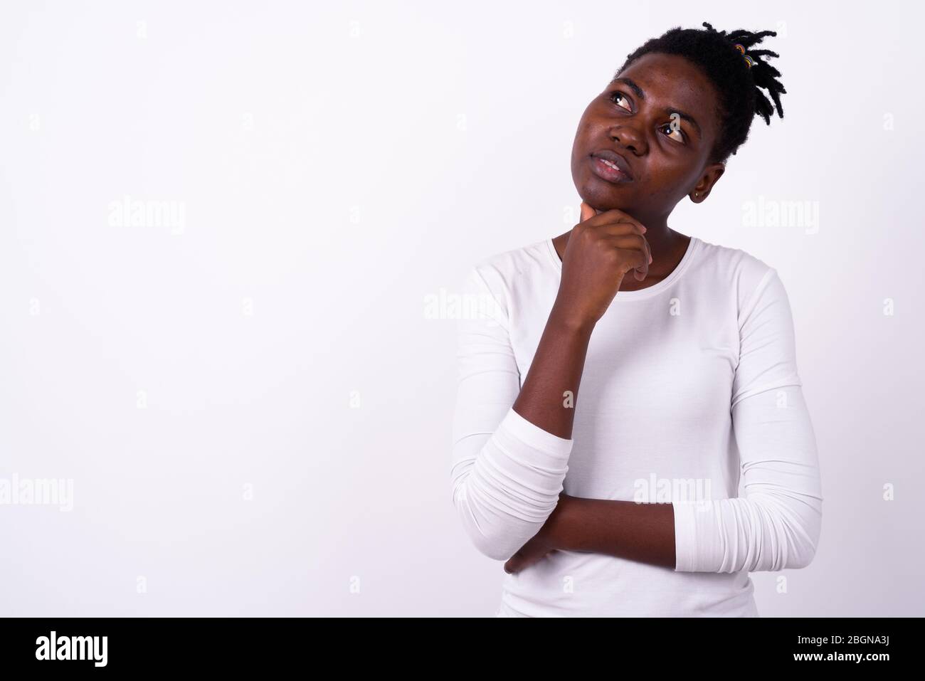 Portrait of young beautiful African woman thinking Stock Photo - Alamy