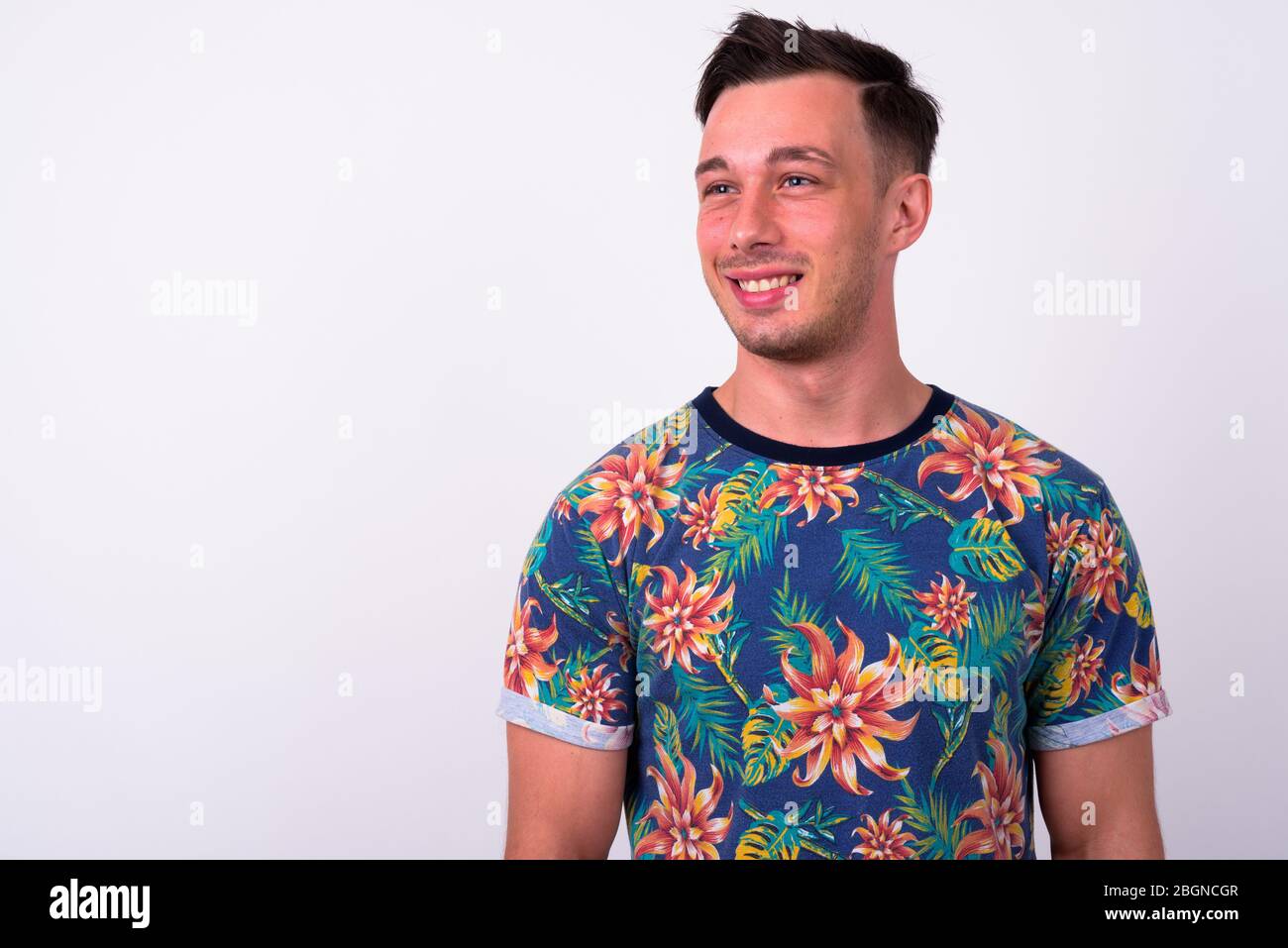 Portrait of happy young handsome tourist man thinking Stock Photo - Alamy