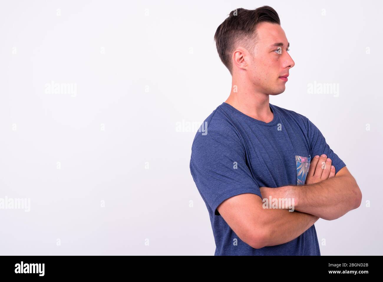 Young man side view crossed arms hi-res stock photography and images ...