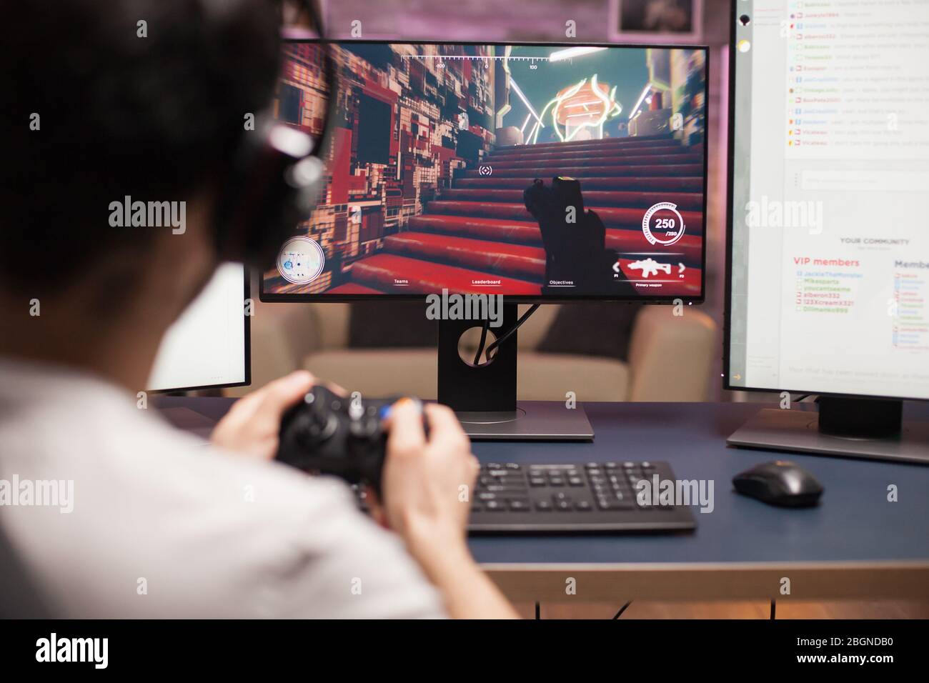 Over shoulder footage of man playing shooter games on stream using ...