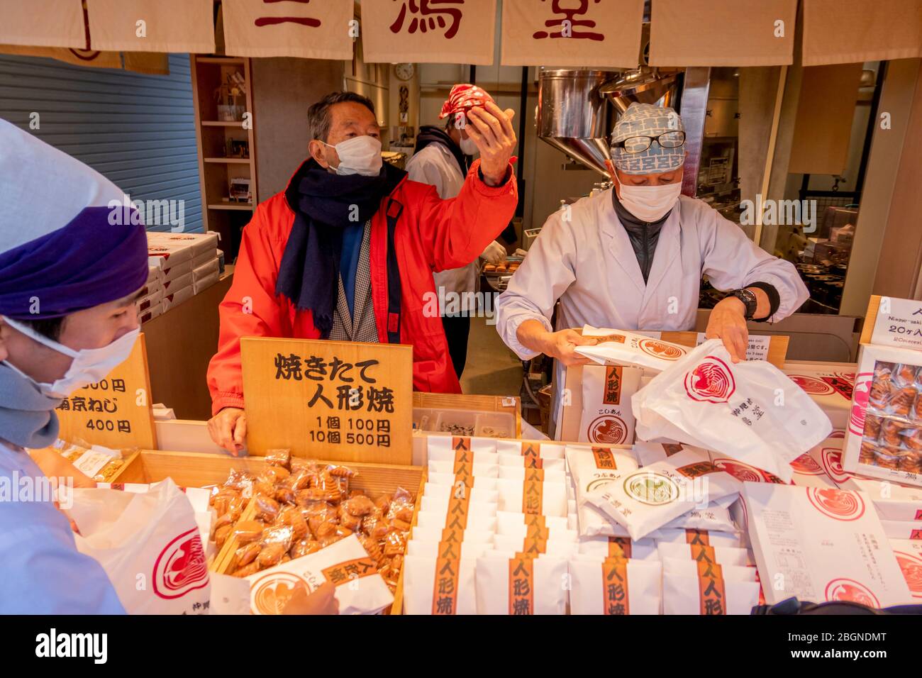 Group of merchants are selling Japanese style baked doll bread which ...