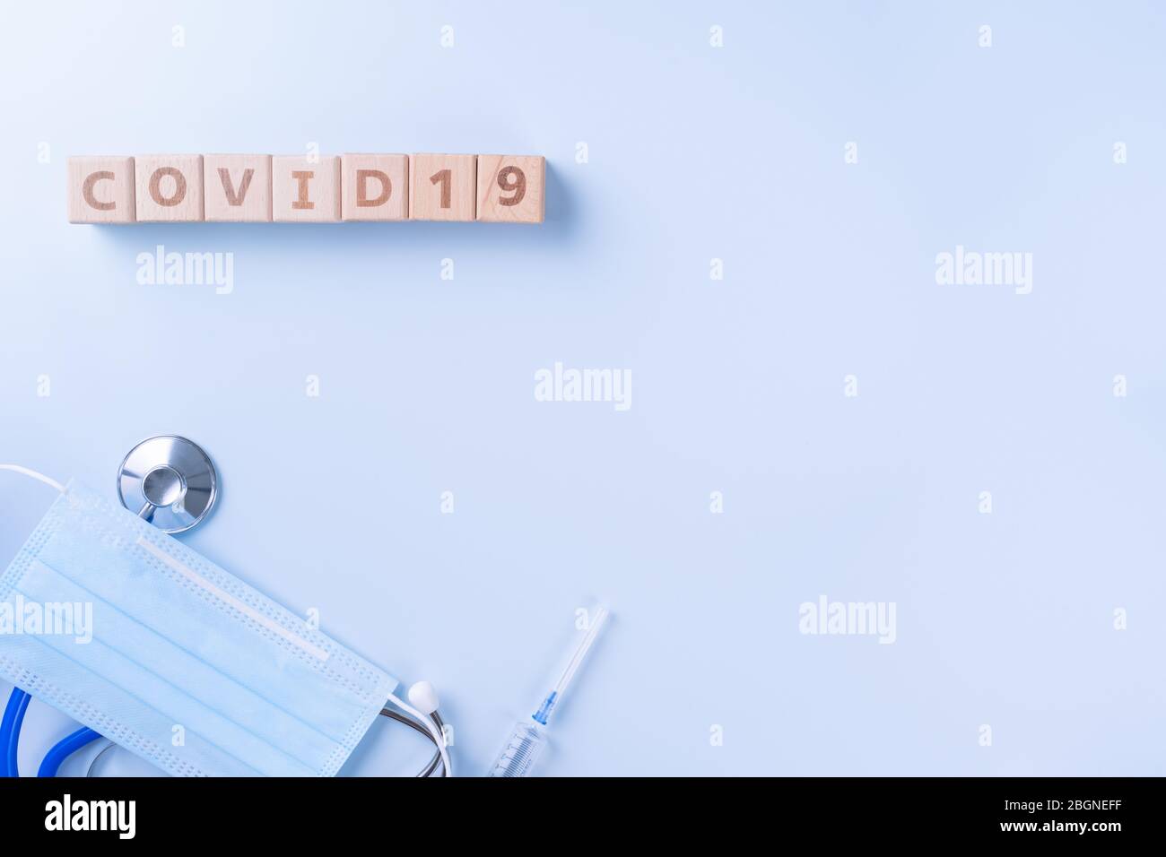 COVID-19 word wooden cube with mask, medical equipment, world disease ...