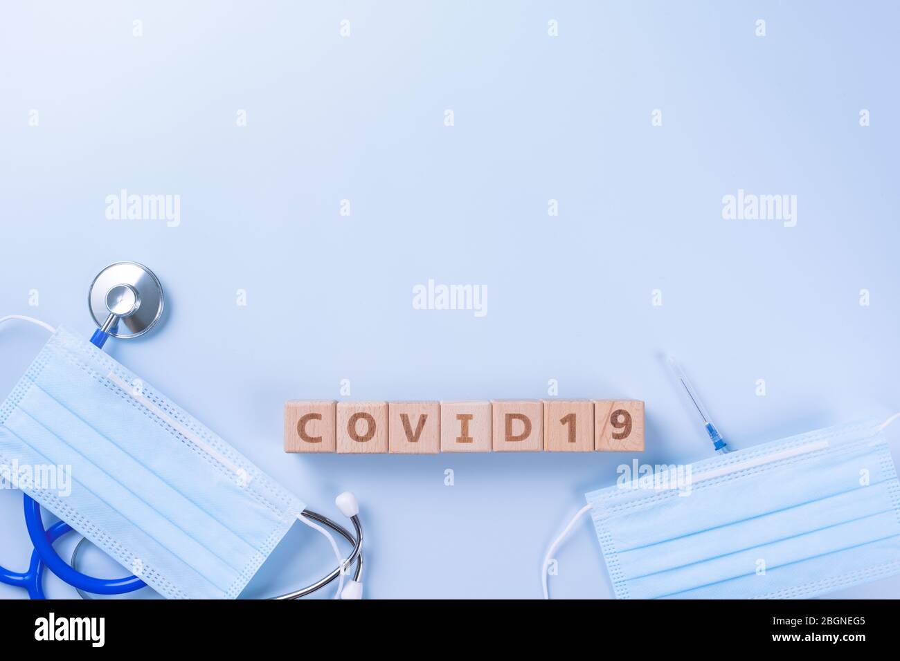 COVID-19 word wooden cube with mask, medical equipment, world disease ...