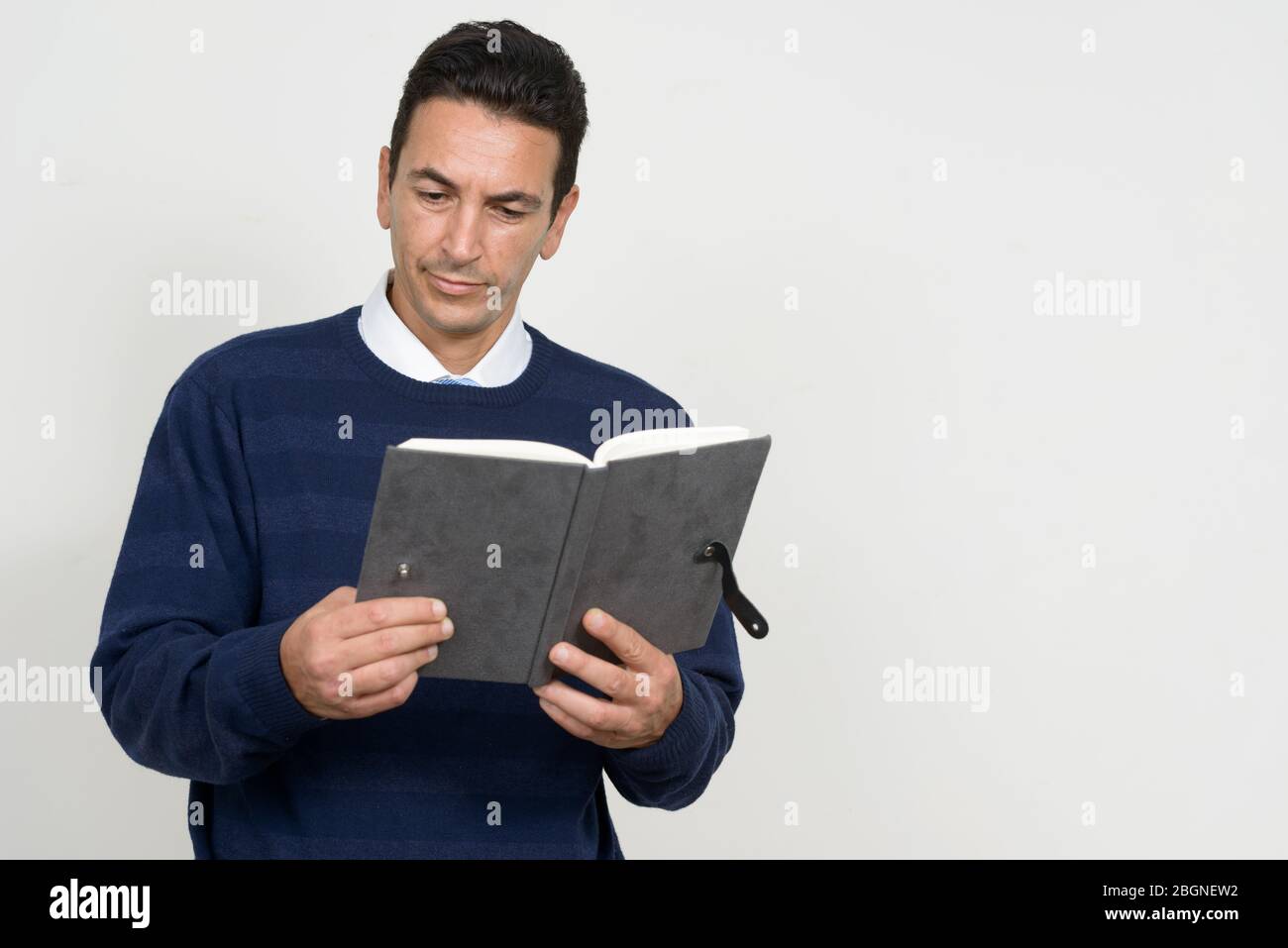 Portrait of mature handsome man reading book Stock Photo - Alamy