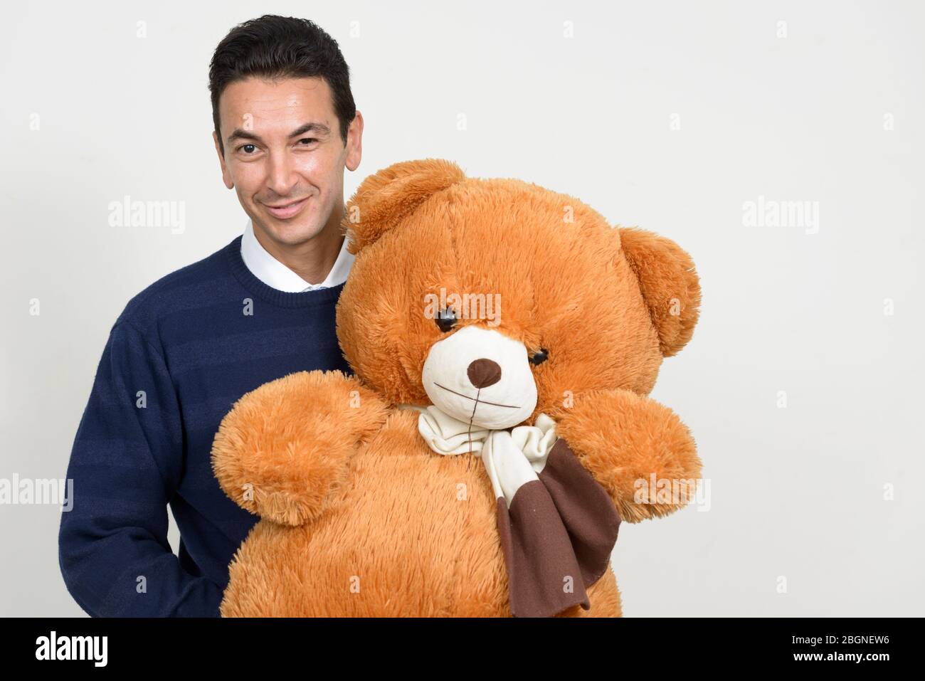 Portrait of happy mature handsome man with big teddy bear Stock Photo ...