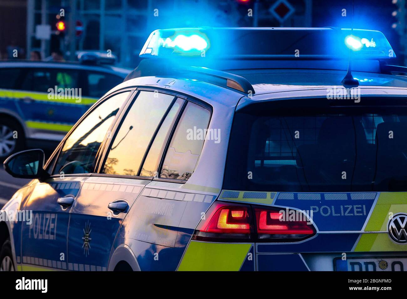 Dresden, Germany. 16th Apr, 2020. Police vehicle in the dusk from ...