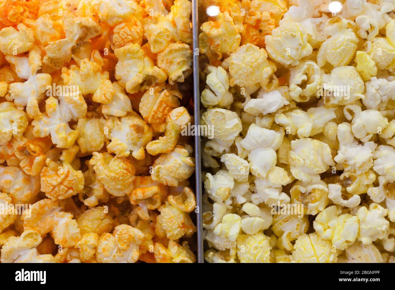 Popcorn background close-up. Assorted popcorn in a movie theater behind ...