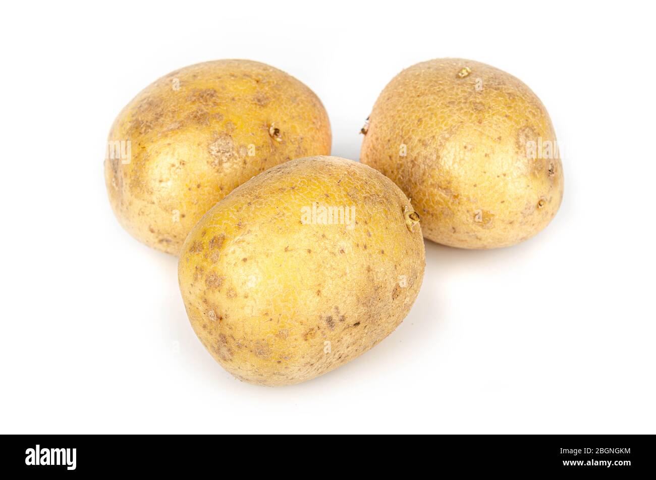 three potatoes on white background, isolated Stock Photo - Alamy