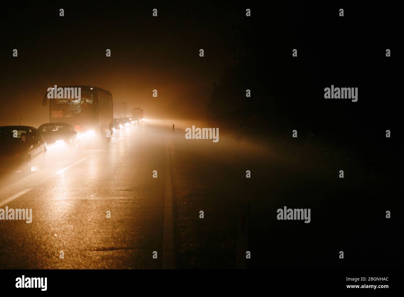 Traffic jam in the smoke. Cars drive through smoke Stock Photo - Alamy