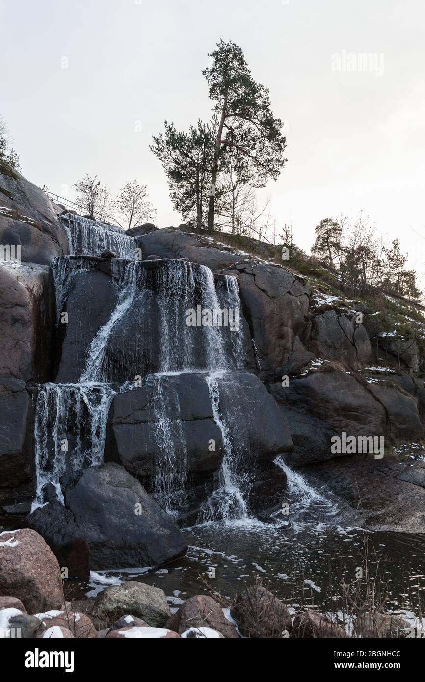 Vertical landscape with waterfall in natural public city park of Kotka ...