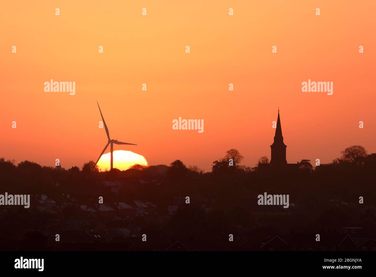A golden sun rising behind St Mary's Church in Garforth & Hook Moor ...