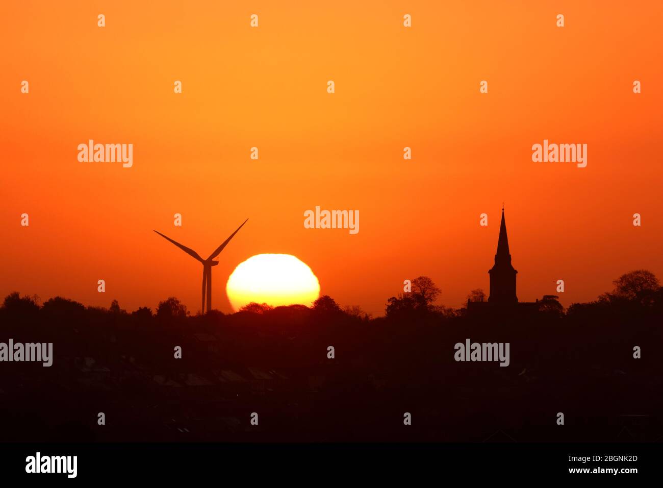A golden sun rising behind St Mary's Church in Garforth & Hook Moor ...