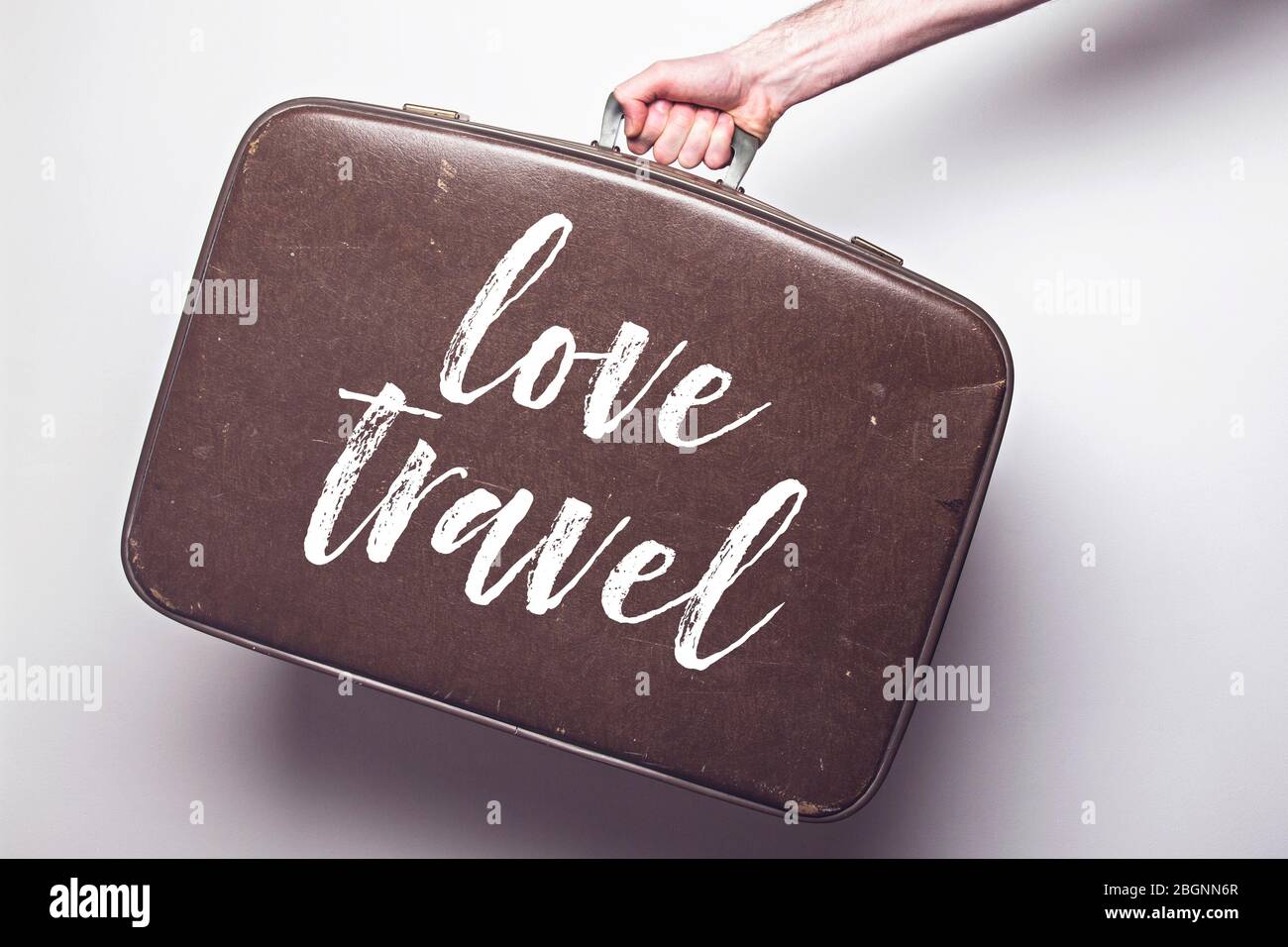 Love travel message on a vintage travel suitcase Stock Photo - Alamy