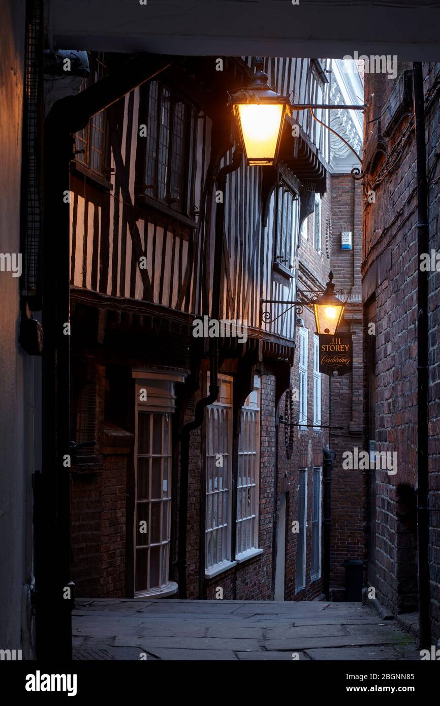 Dark alleyway with J.H. Storey Cordwainer, York Stock Photo - Alamy