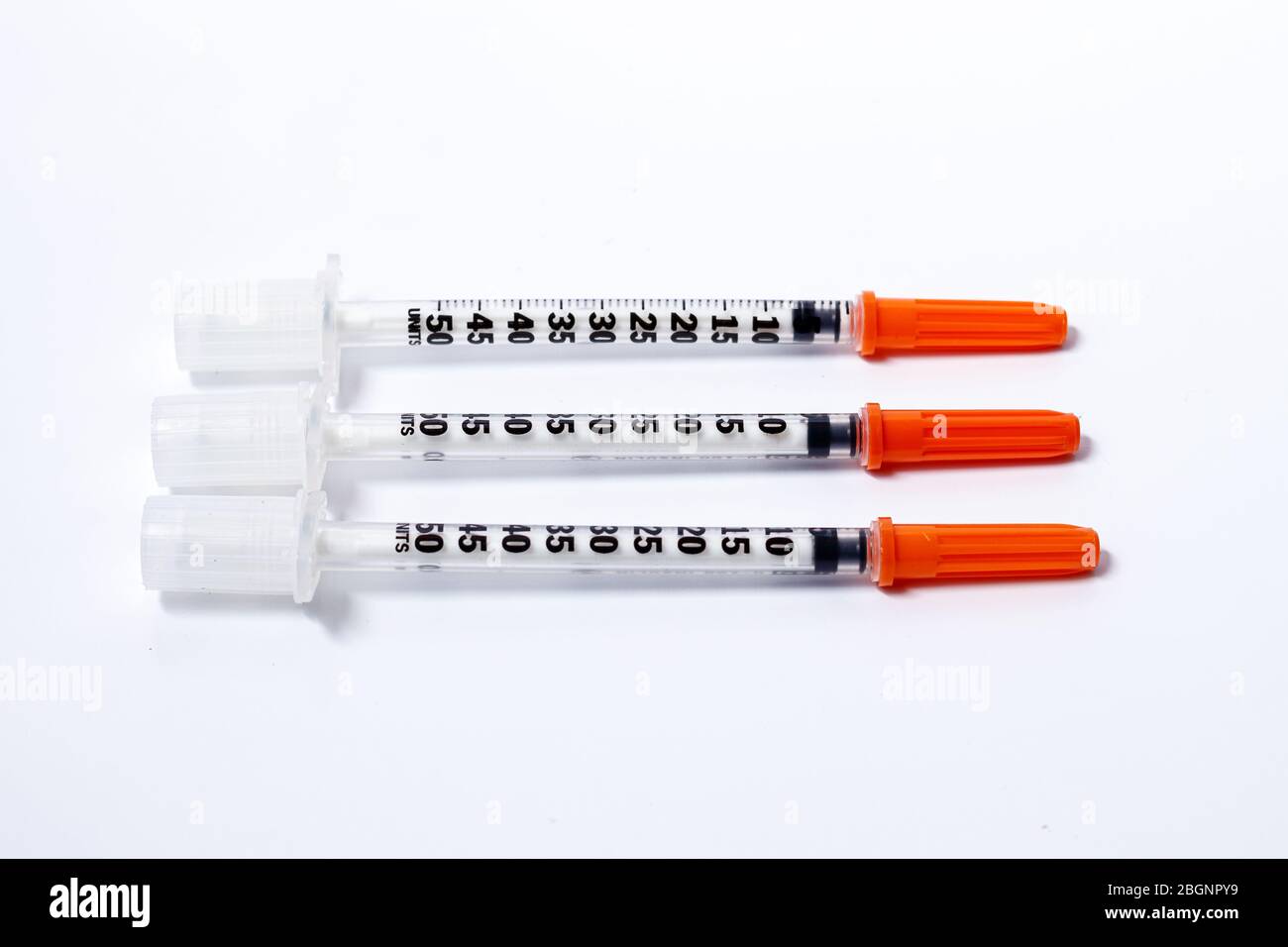 syringe over white background Stock Photo - Alamy