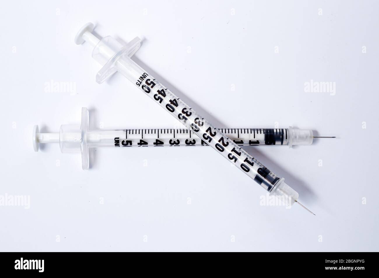 syringe over white background Stock Photo - Alamy