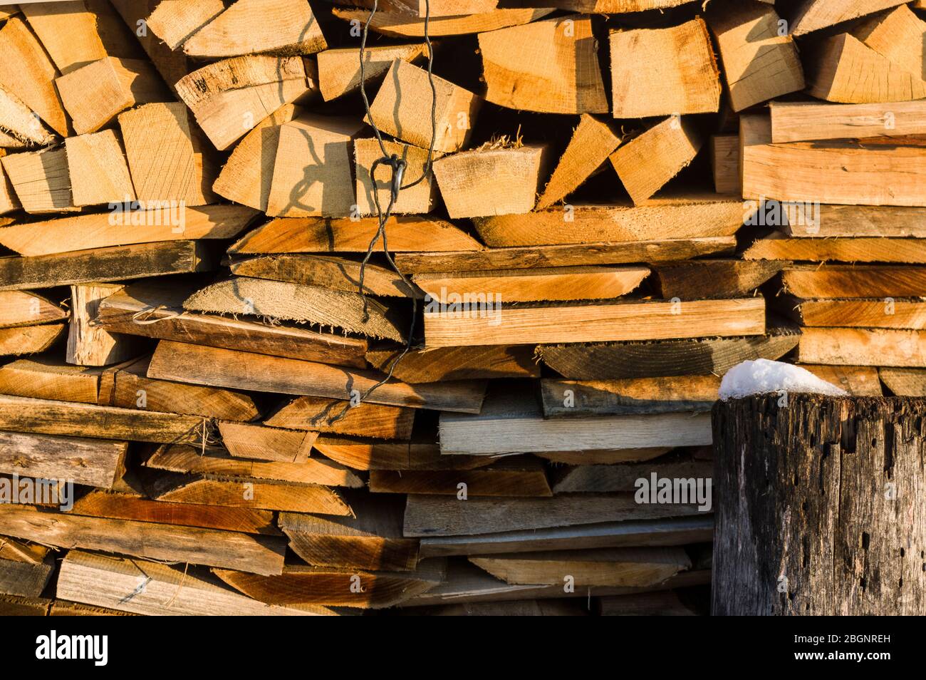 Wood stack of neatly stacked firewood and small wood to dry for ...