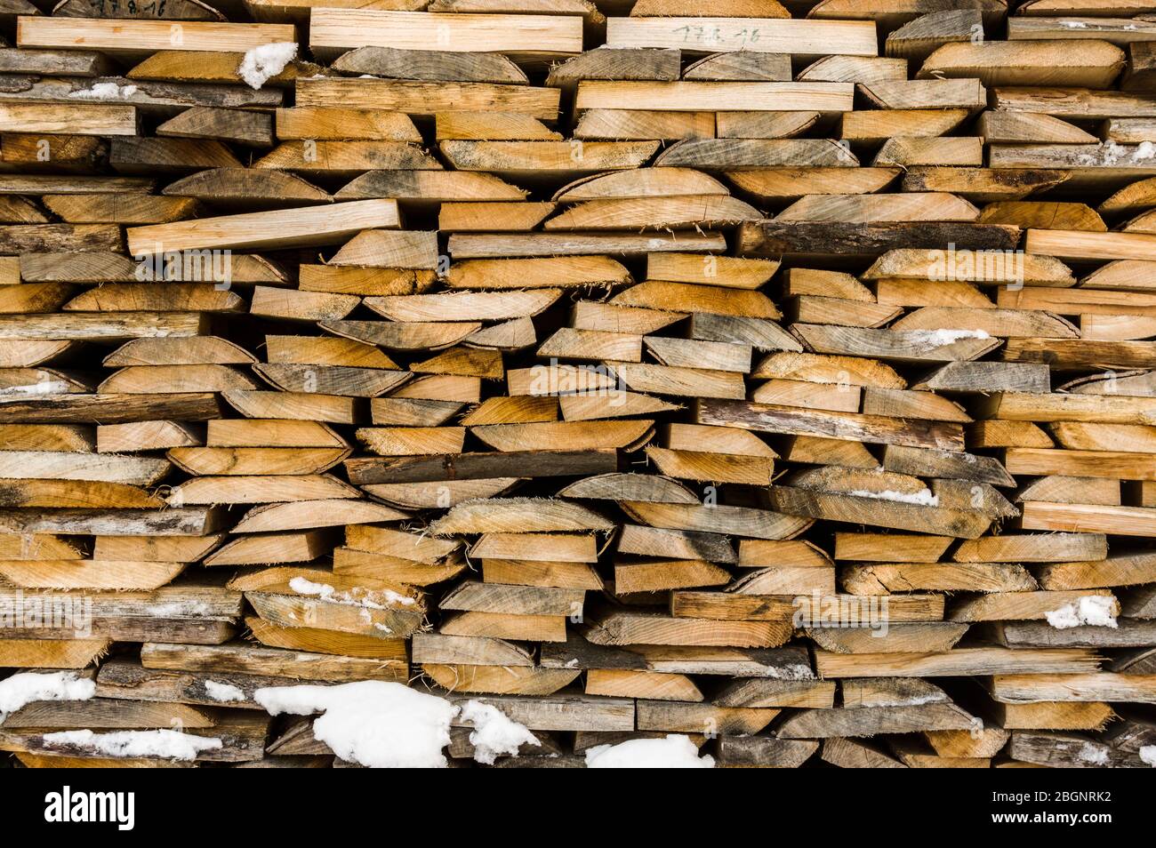 Wood stack of neatly stacked firewood and small wood to dry for ...