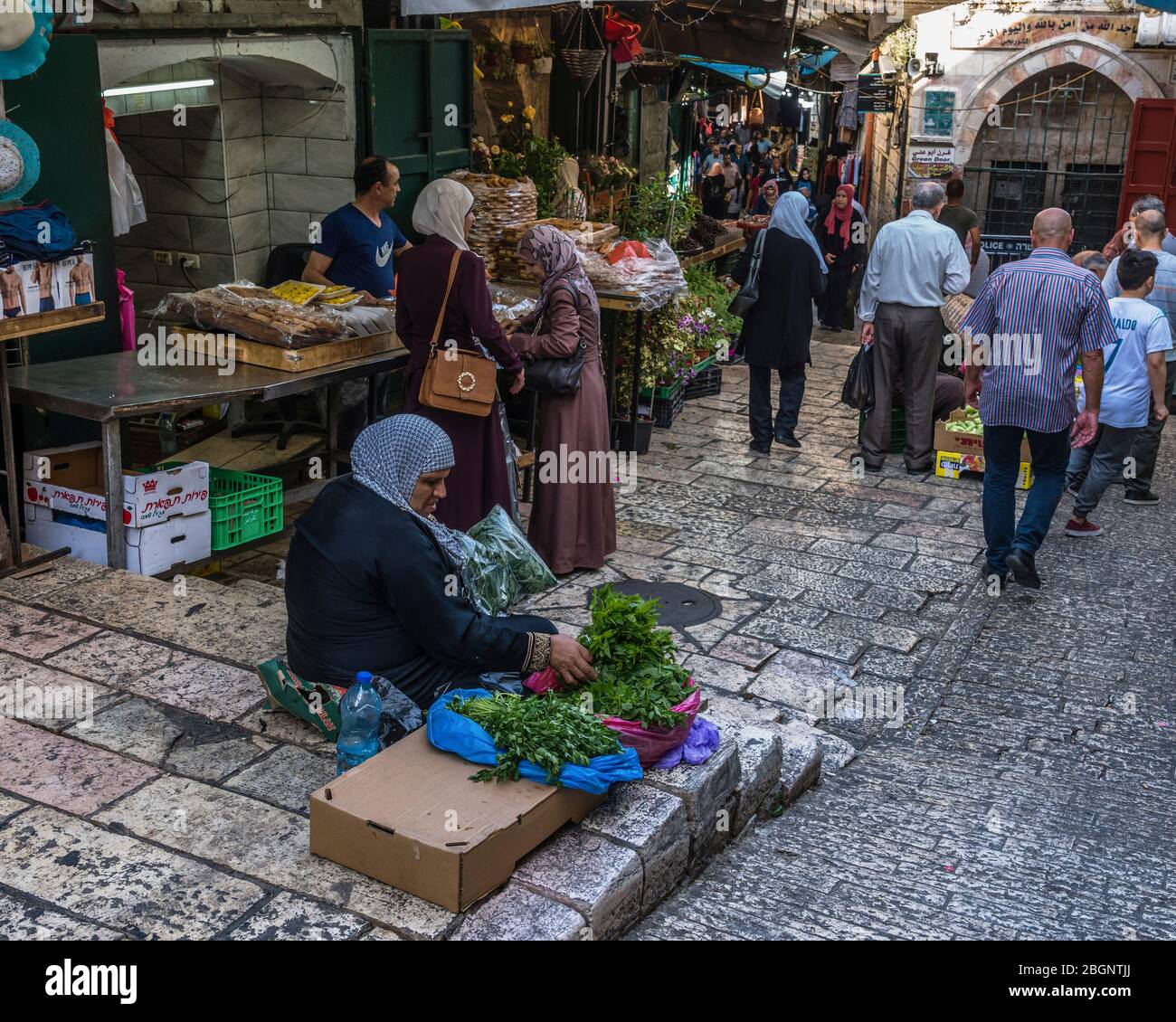 Israel, Jerusalem, A Palestinian Arab woman in tradtional dress sells ...